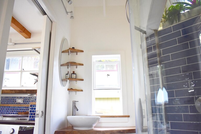 Sleek Tiny House Boasts Enormous Round Window, Outdoor Bar Pass-Through ...