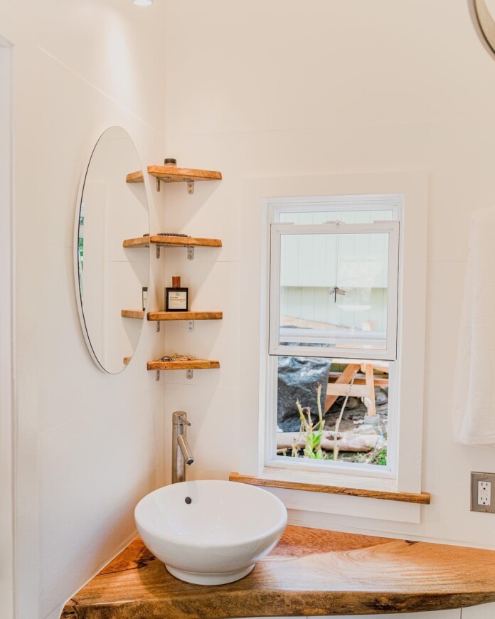 Sleek Tiny House Boasts Enormous Round Window, Outdoor Bar Pass-Through ...