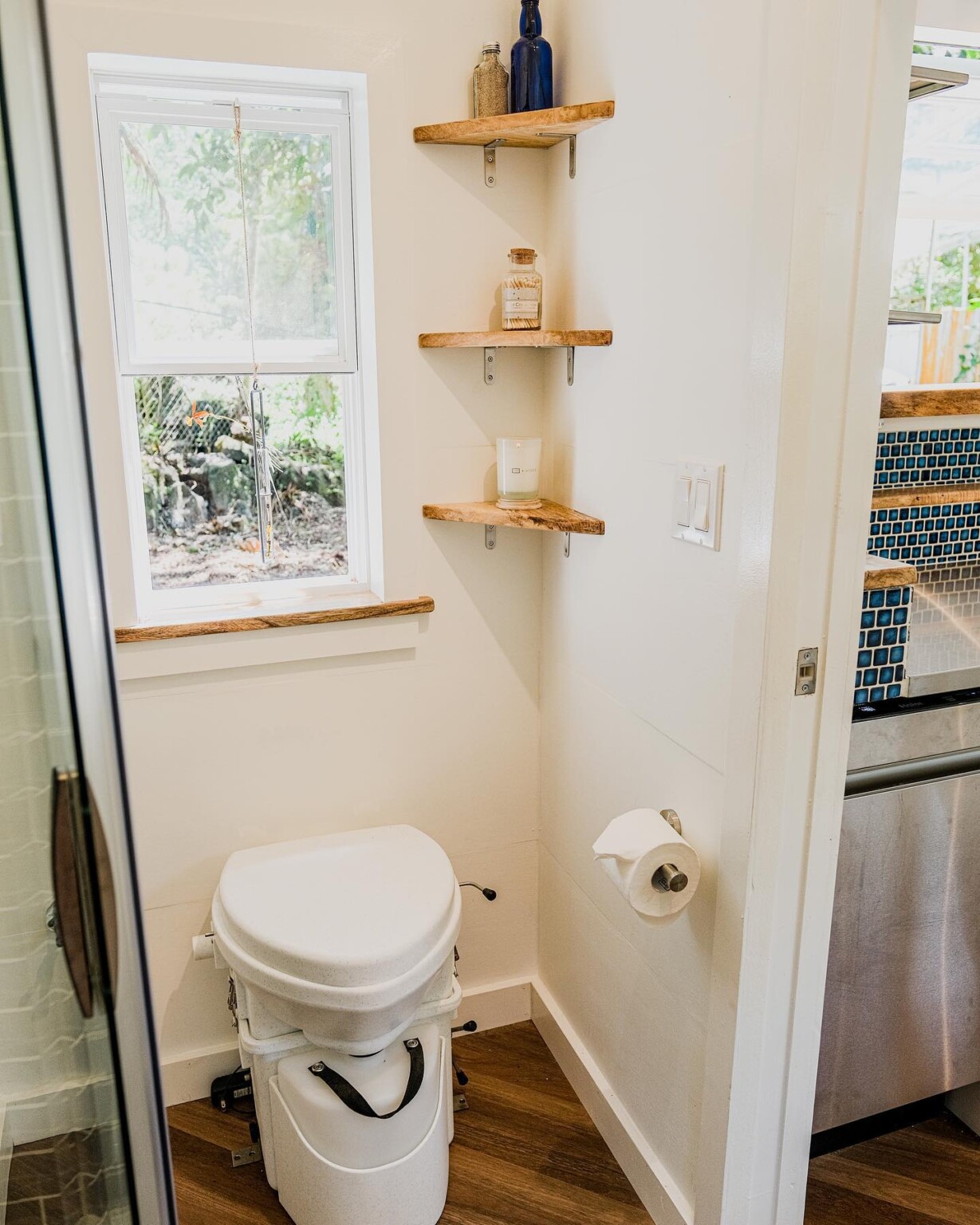 Sleek Tiny House Boasts Enormous Round Window, Outdoor Bar Pass-Through ...