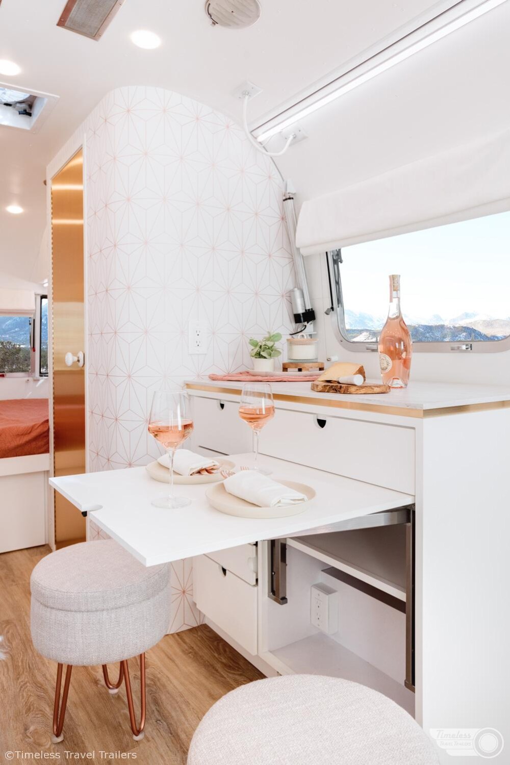 Meet Rosie: The 22-Foot Rose-Gold Airstream with a Built-in Tesla ...